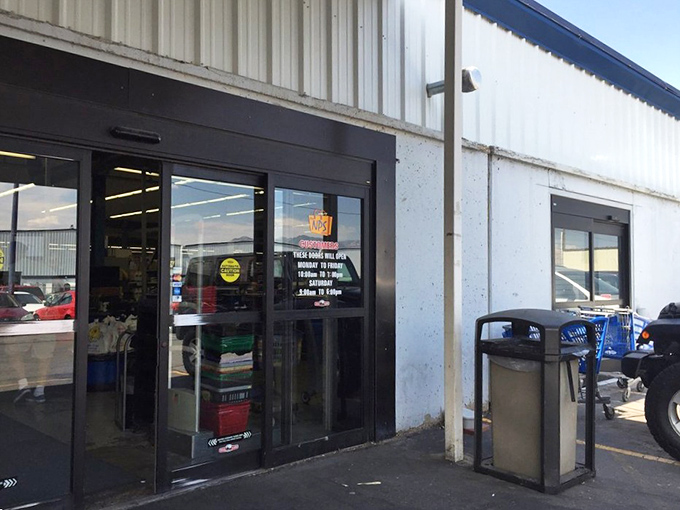 The entrance to bargain paradise, where sliding doors part to reveal a world where retail rules are gloriously broken and savings reign supreme.