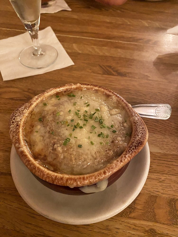 French onion soup done right is like wearing a cheese sweater on a cold day. This bubbling masterpiece demands a moment of silent appreciation. 