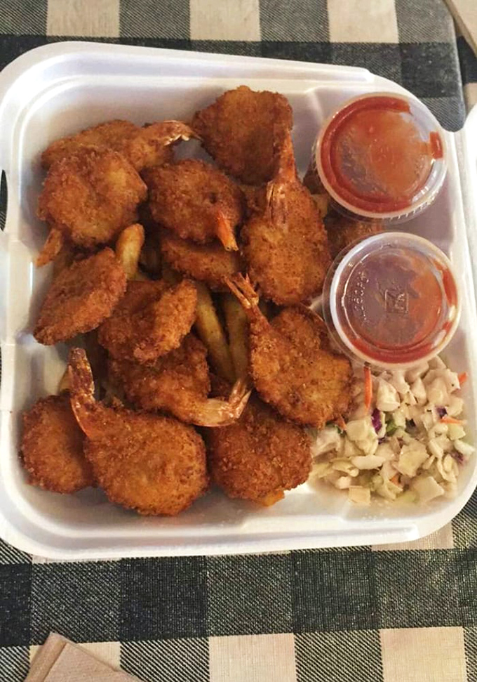 Perfectly fried shrimp that snap when you bite them, surrounded by fries and slaw in a harmony of textures and flavors.