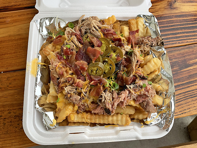 Loaded fries that require a game plan before tackling. The jalape&ntilde;os are there as both warning flares and flavor bombs.