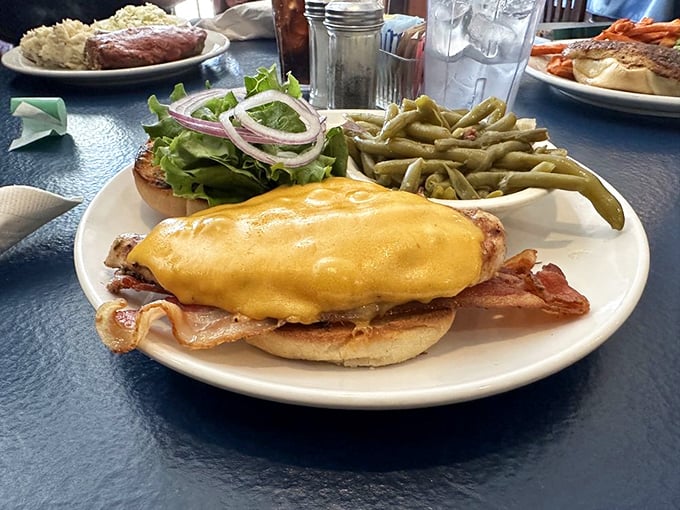 This isn't just a chicken sandwich&mdash;it's a masterclass in balance. Melty cheese, crisp vegetables, and that bun holding everything together like a culinary mediator.