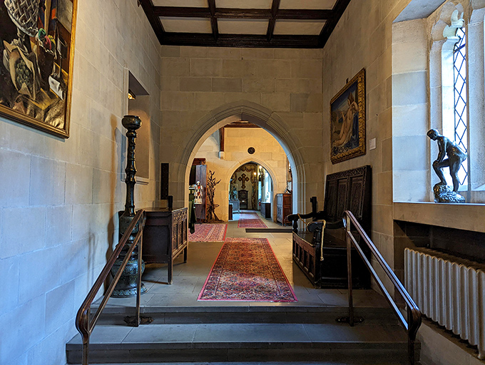 Gothic arches frame doorways throughout the house, creating dramatic transitions between rooms that feel more like chapters in a historical novel than mere passageways.