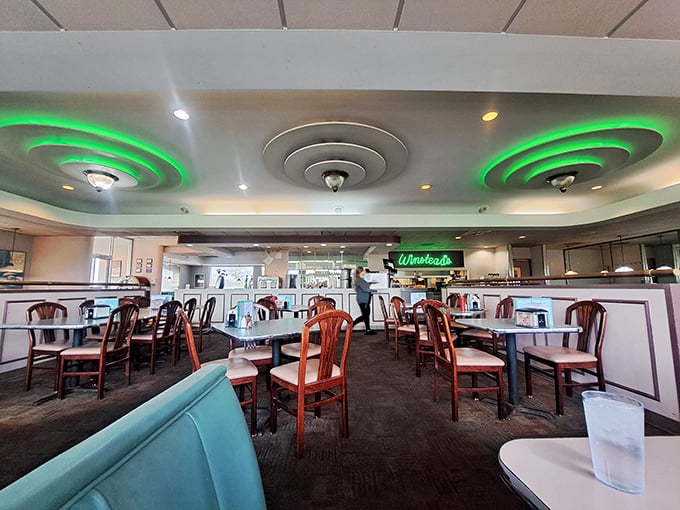 Those distinctive ceiling rings glow like halos over diners about to experience steakburger bliss. Divine intervention in restaurant form.