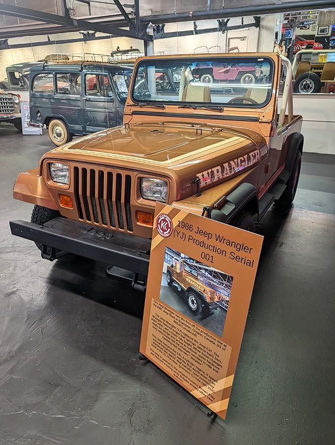 The very first Jeep Wrangler ever produced sits proudly on display. This rugged icon launched thousands of off-road adventures and suburban status symbols.