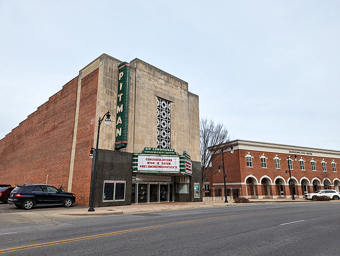 The historic Pitman Theatre's vertical sign stands as a beacon of entertainment, a vintage landmark in Gadsden's cultural landscape.