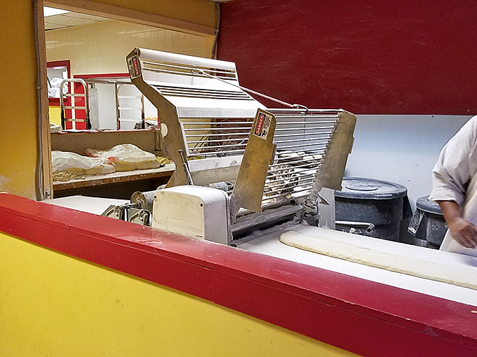 Behind the scenes where magic happens&mdash;this glimpse into Pharaoh's kitchen reveals the bread-slicing machine that's part of the donut production process.