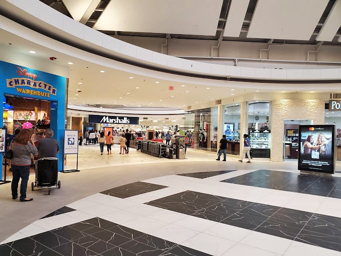 Marshalls anchors this wing like a treasure cave. The shopping cart isn't just transportation&mdash;it's optimism on wheels.