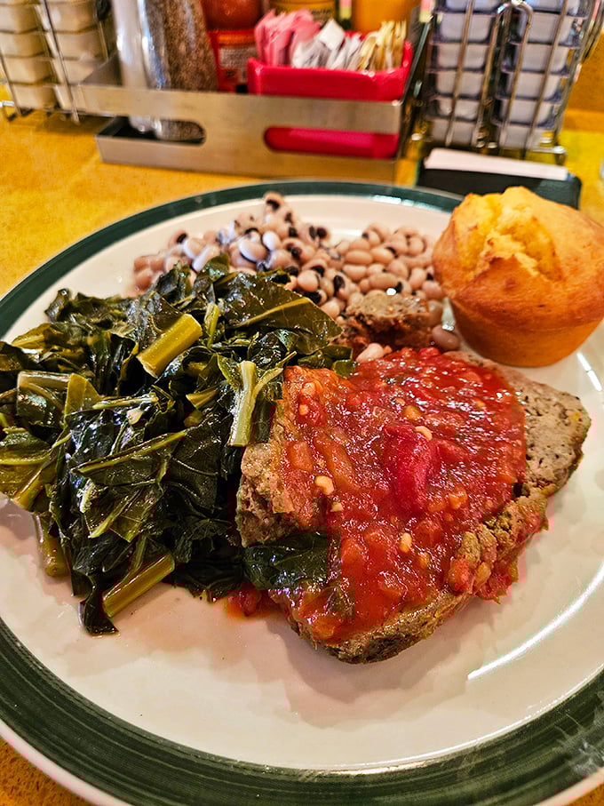 Meatloaf that doesn't apologize for being meatloaf, served with greens that spent quality time with pork and black-eyed peas that mean business.
