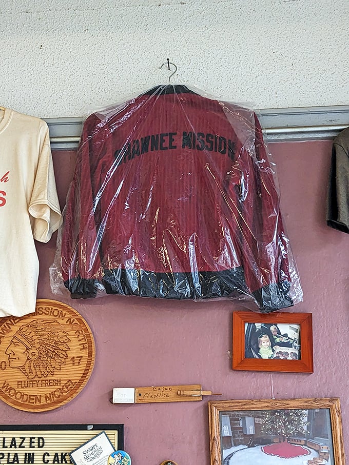 Local pride hangs from every wall. That Shawnee Mission jacket has witnessed more donut transactions than most of us have had hot breakfasts.