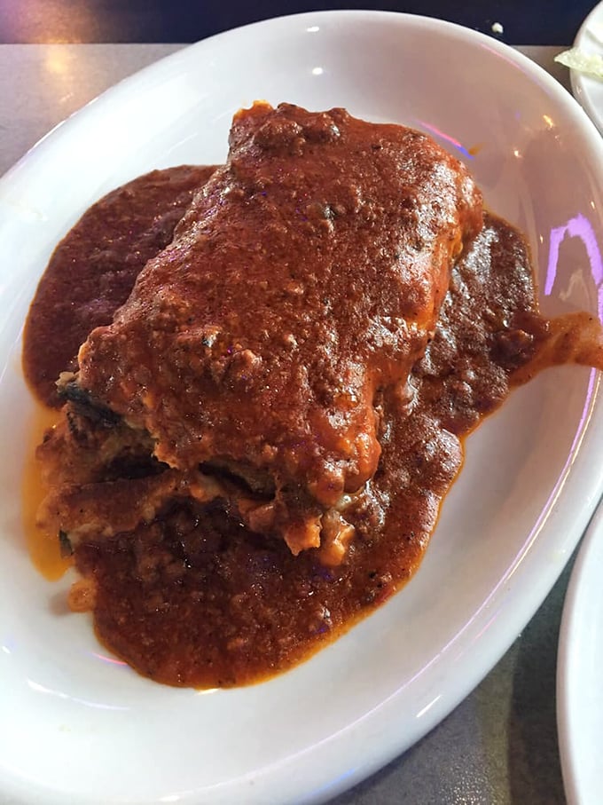 Moussaka – the casserole that went to finishing school in Athens. Layers of eggplant, meat sauce, and creamy béchamel in perfect harmony.