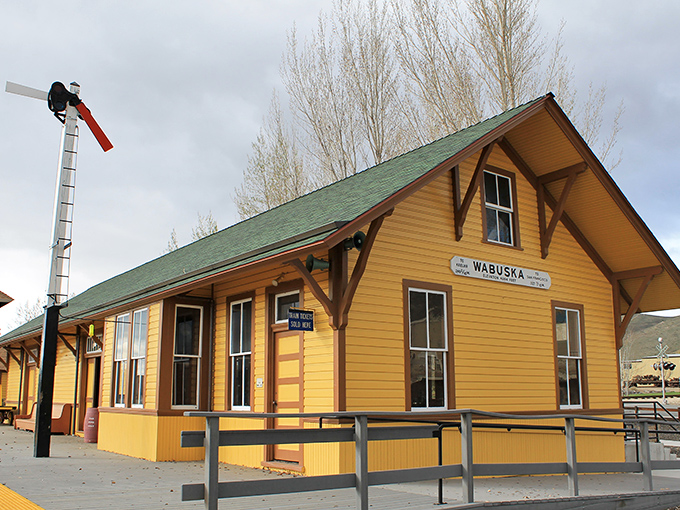 The cheerful yellow Wabuska train depot at the Nevada State Railroad Museum reminds us that trains once connected this frontier to the world.