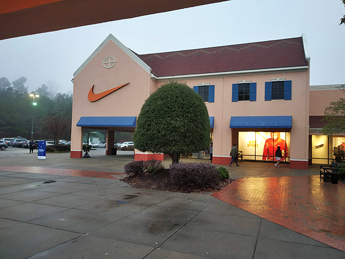 Nike's iconic swoosh glows like a lighthouse for athletic wear enthusiasts navigating the sea of outlet options.