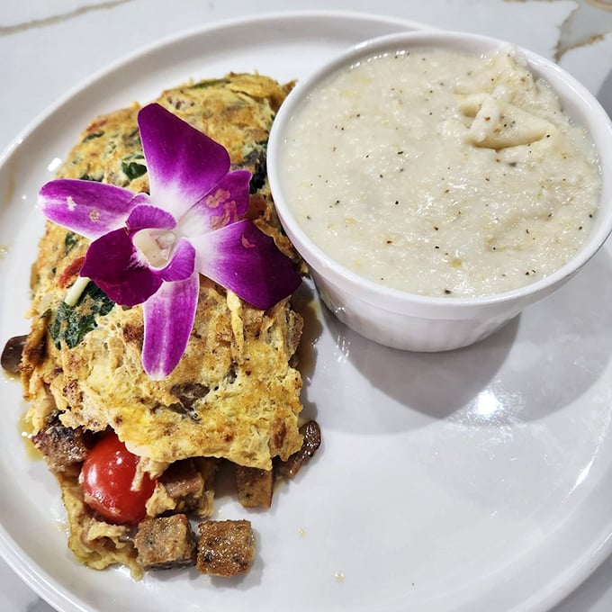 This omelet, adorned with an orchid, is clearly showing off&mdash;and has every right to do so.