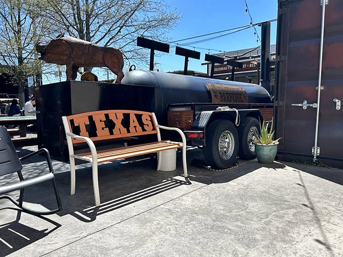 The smoker&mdash;where the magic happens. That "TEXAS" bench isn't just seating&mdash;it's a declaration of barbecue philosophy.