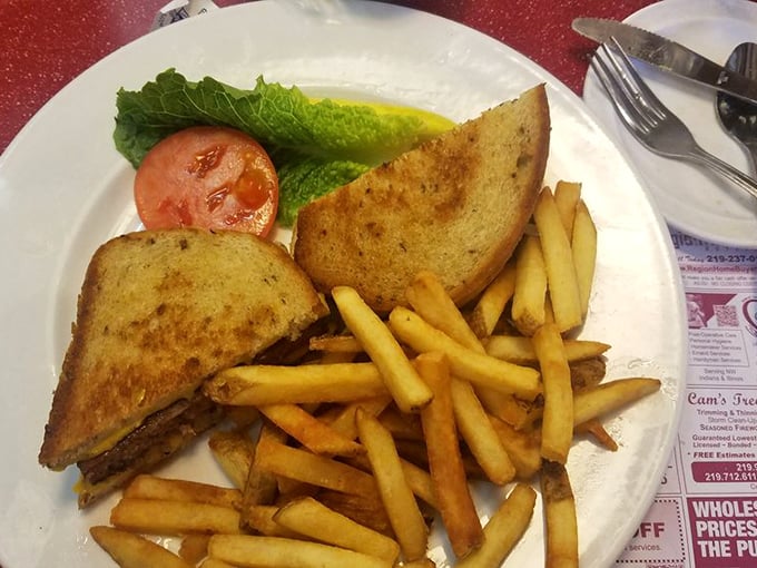 A sandwich that understands the importance of proper toast-to-filling ratio. Those fries are standing at attention, ready for their ketchup salute.