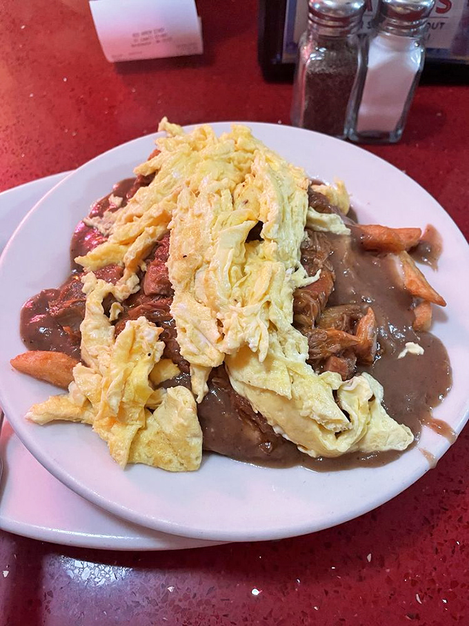Breakfast poutine that makes Canadians nervous &ndash; a glorious mess of fries, eggs, meat, and gravy that laughs in the face of diet culture.
