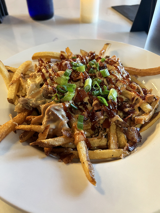 Loaded fries that refuse to be relegated to side dish status. Topped with savory goodness and green onions, they're the supporting actor that steals the show.