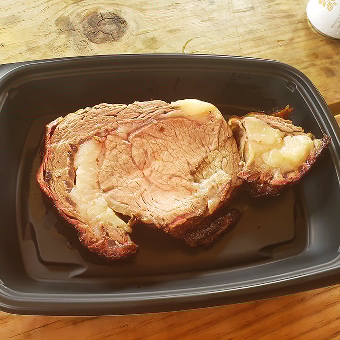 Prime rib that doesn't just melt in your mouth—it throws a party there. This isn't just meat; it's a masterclass in patience.