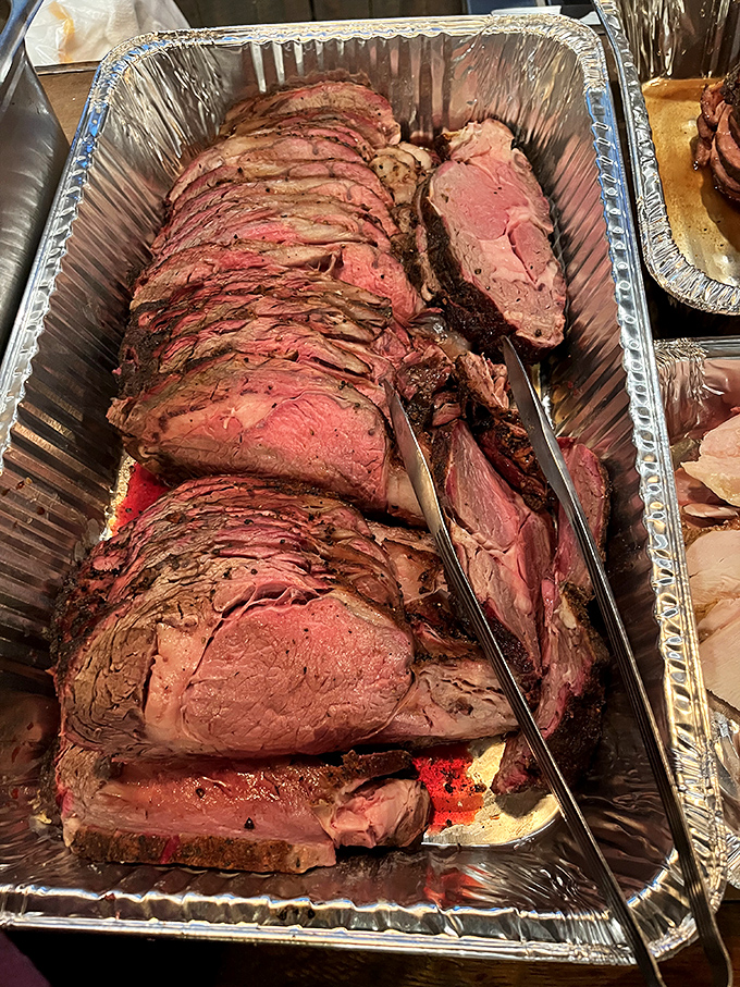 This prime rib, sliced with reverent precision, showcases the perfect gradient from bark to center&mdash;a testament to low-and-slow cooking methods that can't be rushed.