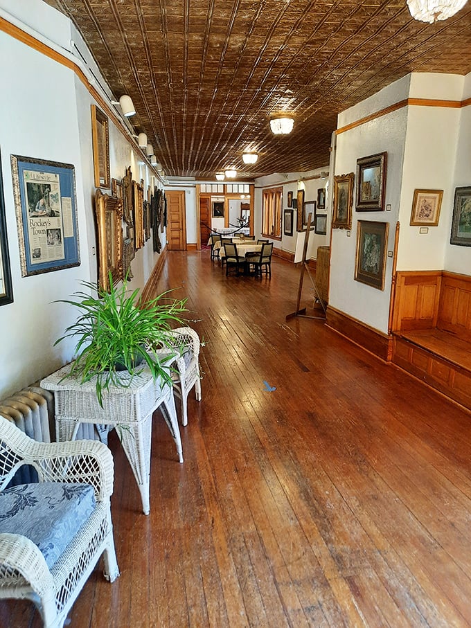 The Queen's Parlour Tea Room's elegant hallway invites you to stroll through history, perhaps pausing to admire the pressed tin ceiling.