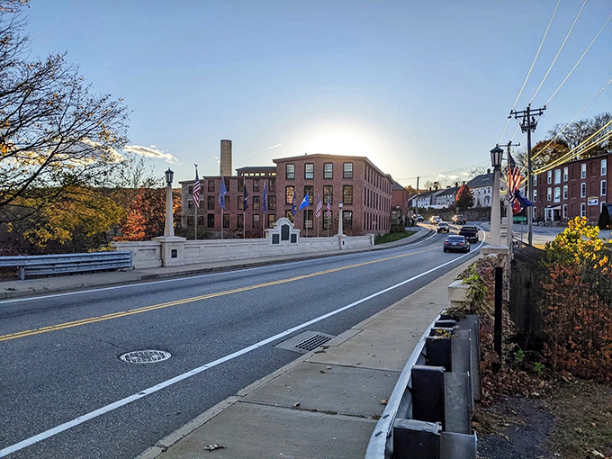Sunset gilds Putnam's historic mill buildings with golden light. Industrial architecture repurposed for modern living without Manhattan price tags.