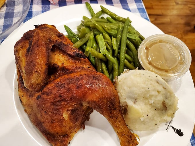 Half a chicken that's fully committed to flavor, accompanied by sides that refuse to be overshadowed. A plate of perfect harmony.