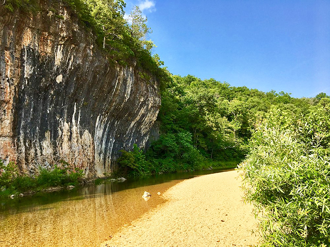 Nature's infinity pool with a limestone backdrop that no resort can match. The golden streambed glows like treasure beneath the crystal-clear water.