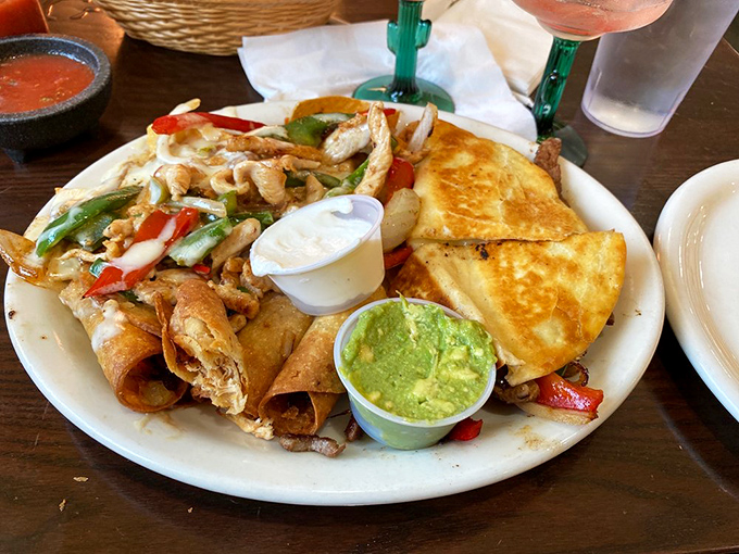 The sampler platter that answers the eternal question, "Why choose one perfect thing when you can have four?" That guacamole is practically winking at you.