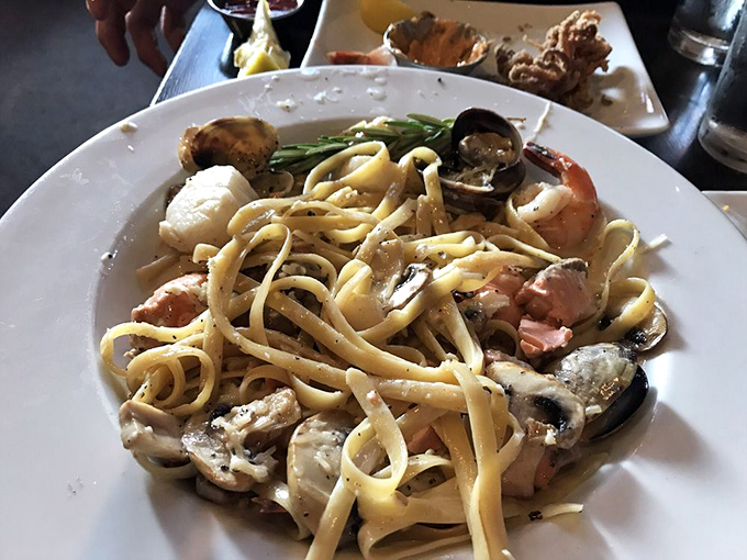 Fresh seafood and mushrooms tossed in a creamy sauce over fettuccine noodles provide you with a hearty and delicious meal.