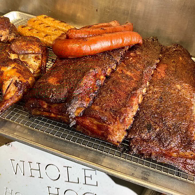 Behold the smoker's bounty in all its glory. Those ribs, chicken, and sausage aren't just sitting there&mdash;they're calling your name in a smoky chorus.