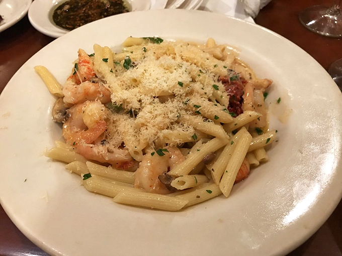 Penne and shrimp playing nicely together in a pool of sauce that's asking to be sopped up with bread. Seafood pasta without pretension.