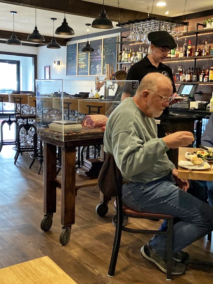 Where the magic happens – the meat display cart and staff represent the front lines in the battle against mediocre dining experiences.