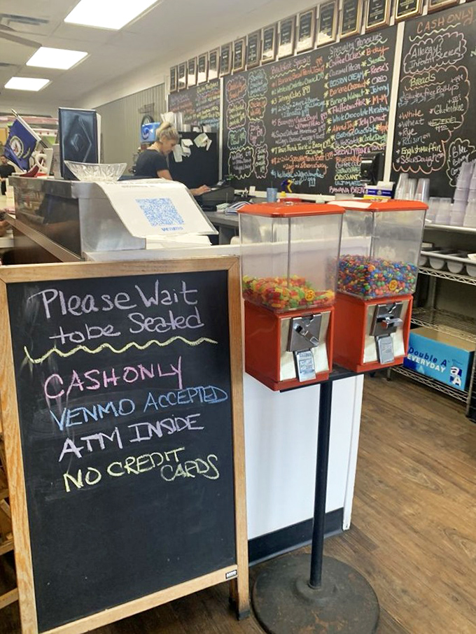 Candy machines stand sentinel by a "Cash Only" sign, adding old-school charm to this no-frills breakfast haven where simplicity reigns supreme.