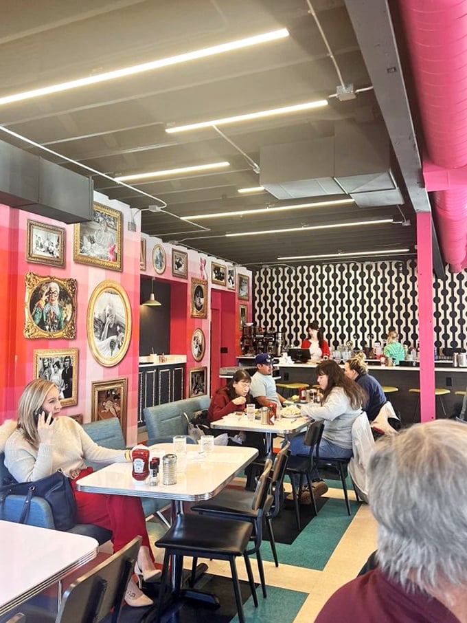 Whimsical breakfast-themed art watches over diners like a guardian angel of good taste, ensuring no morning goes unappreciated. 