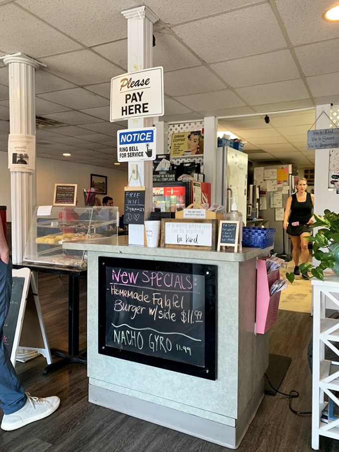 The counter where magic happens—where orders are placed and culinary dreams come true. Note the special board's tempting offers!