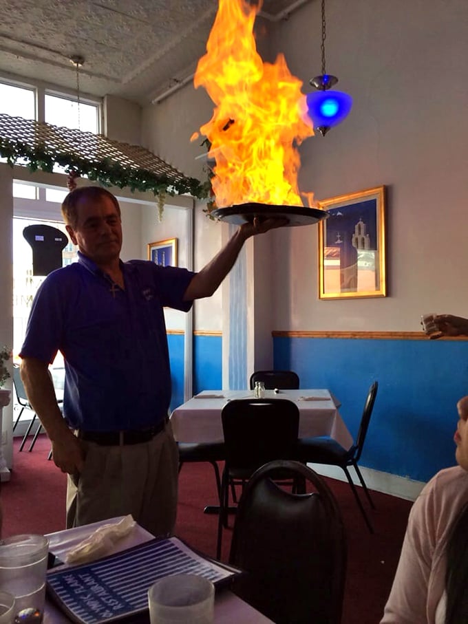 The flaming saganaki performance&mdash;where cheese meets fire in a spectacular tableside show that's equal parts danger and deliciousness.