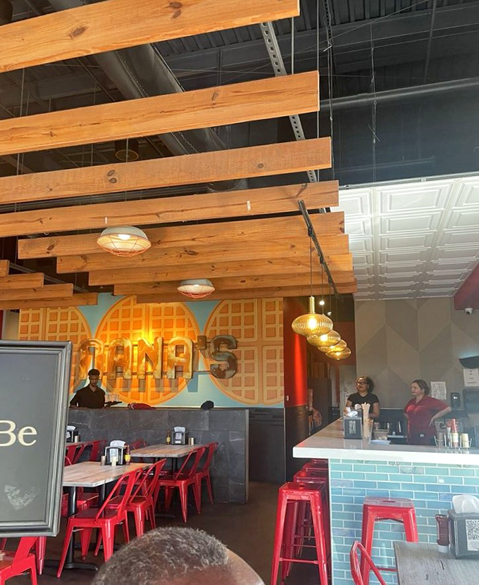 Wooden ceiling beams and waffle-patterned wall art create the ideal backdrop for comfort food indulgence. The staff ready to make your brunch dreams reality.