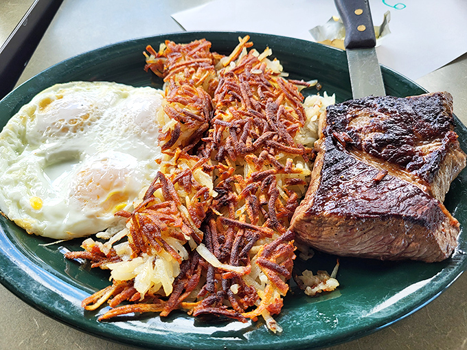 Steak and eggs: the breakfast of champions who plan to skip lunch. Those hash browns have achieved the golden ratio of crispiness.