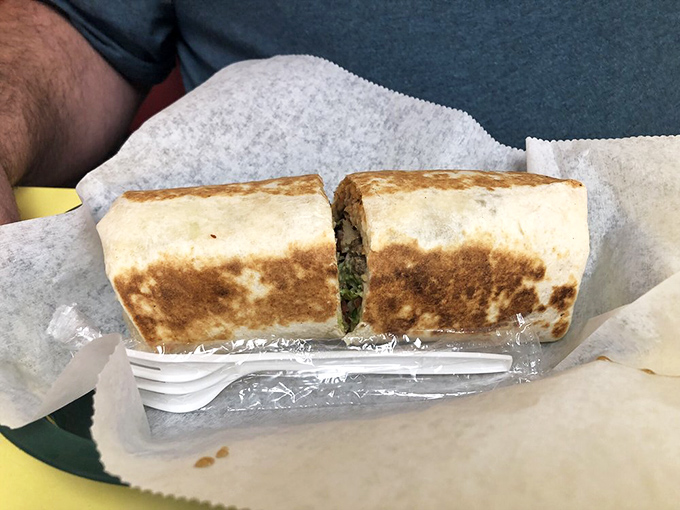 A perfectly grilled burrito, cut to reveal its secrets. Like a good novel, it's what's inside that counts, but the beautifully browned exterior tells you it's special.