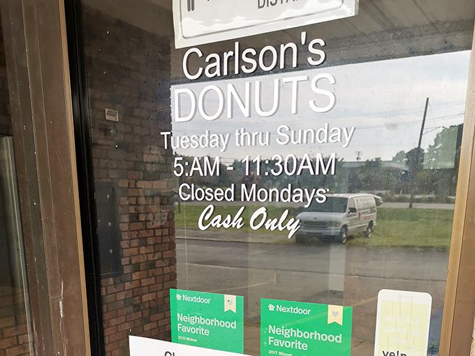 The door tells the whole story: Tuesday through Sunday, 5:00 AM until 11:30 AM, cash only. Simple rules for accessing paradise.