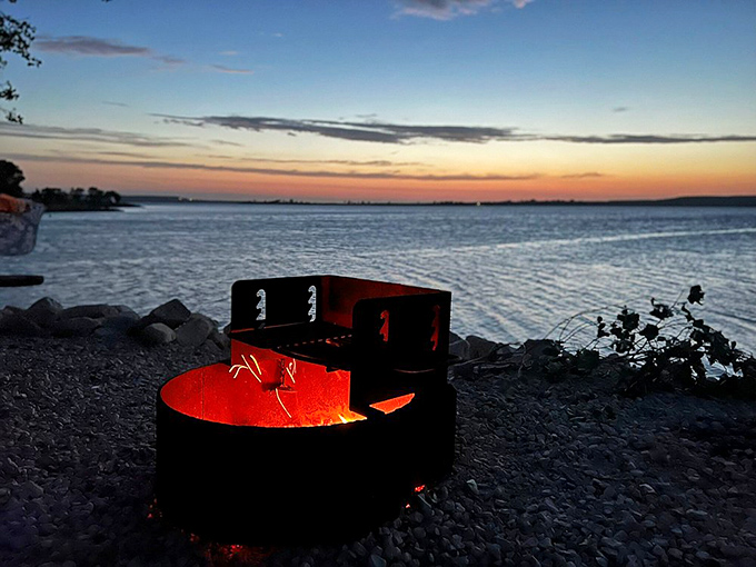 Sunset campfires create the perfect ending to adventure-filled days. Some of life's best conversations happen around these flames as the lake fades to silver.