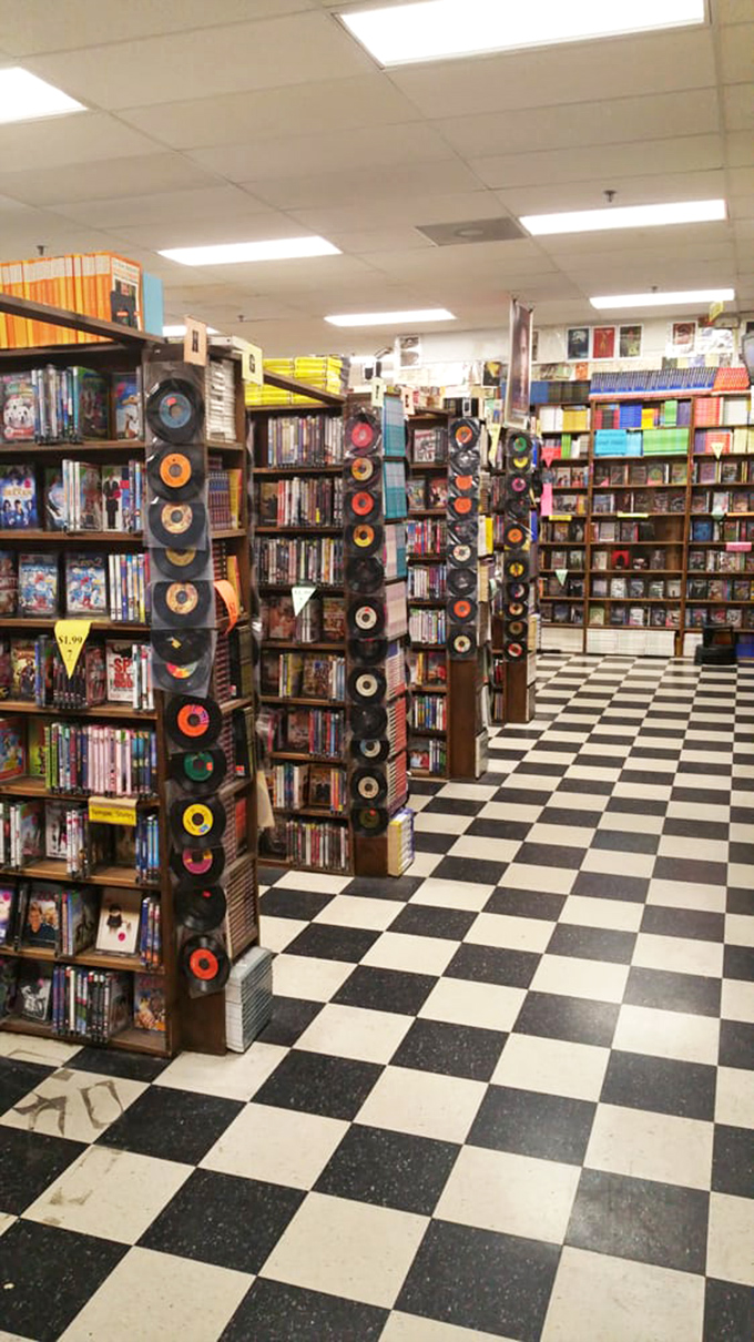 Vinyl records stand like colorful soldiers along the walls, their circular sentinels watching over the media section with nostalgic pride.