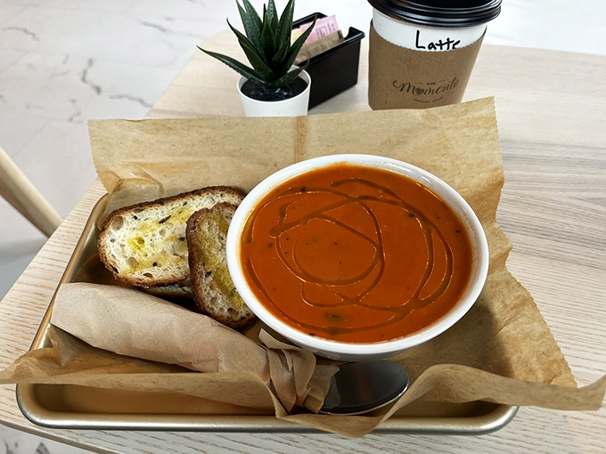 Tomato soup reimagined: vibrant, velvety, and served with bread that's ready to dive in. Comfort food that received a proper education.