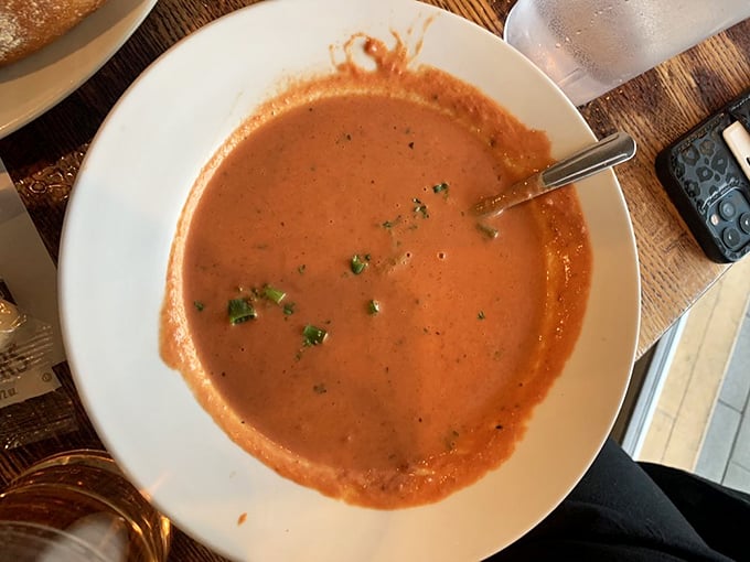This isn't just tomato soup—it's a warm hug in a bowl. Vibrant, herb-flecked, and begging to be paired with that amazing bread.