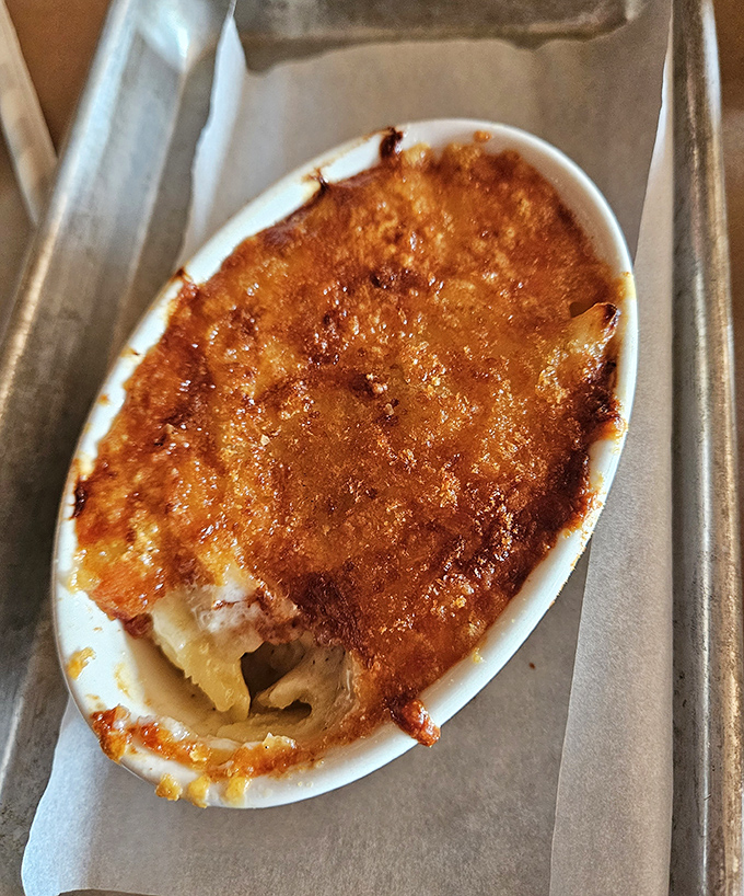 Mac and cheese so serious about its job it needs its own dish. The golden crust is nature's way of saying "dig here for happiness."