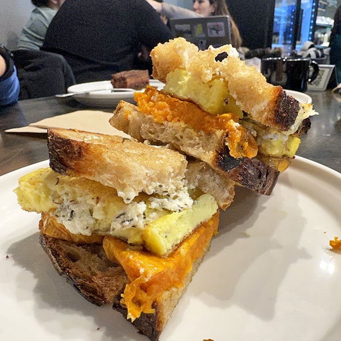 A sandwich stacked with such architectural precision that Frank Lloyd Wright would approve. Each layer creating a different note in the flavor symphony.