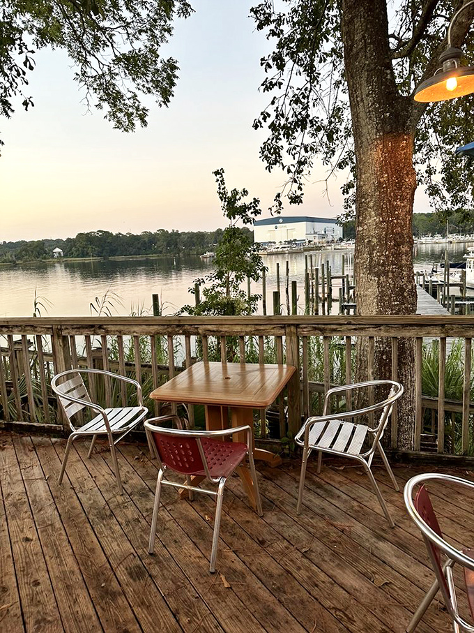 Sunset transforms Boggy Bayou into a shimmering canvas of gold and pink&mdash;nature's dinner theater for lucky patrons seated on the deck.