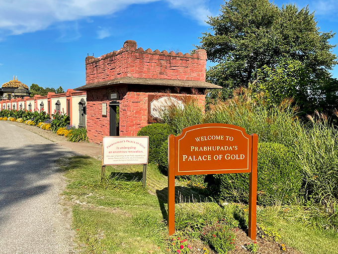 The unassuming entrance sign offers no hint of the golden extravaganza waiting beyond. Talk about burying the lead!