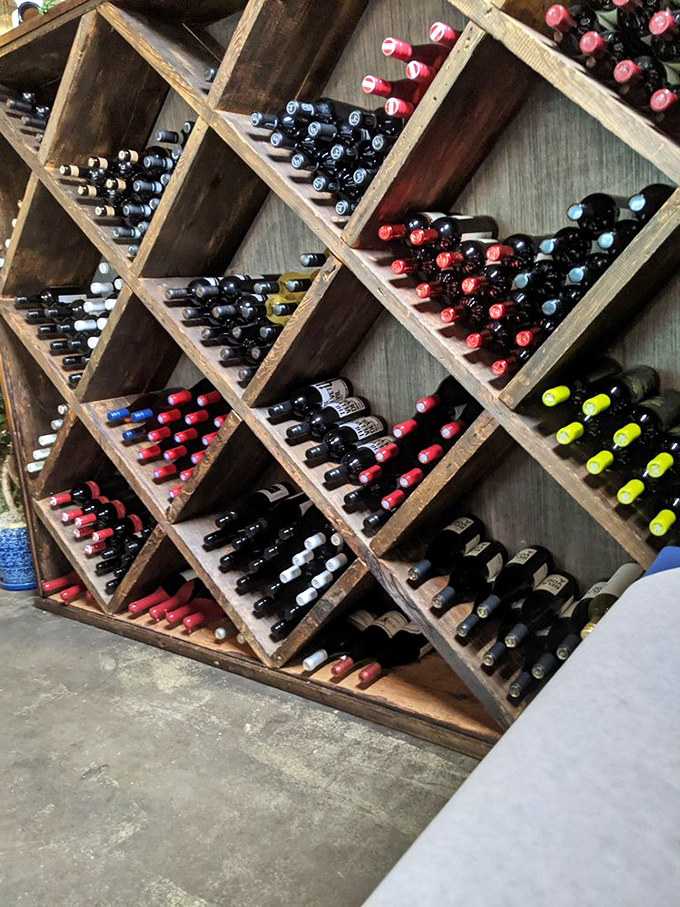 This isn't just wine storage&mdash;it's a wooden altar to Dionysus himself, with bottles waiting to complement your Mediterranean feast.