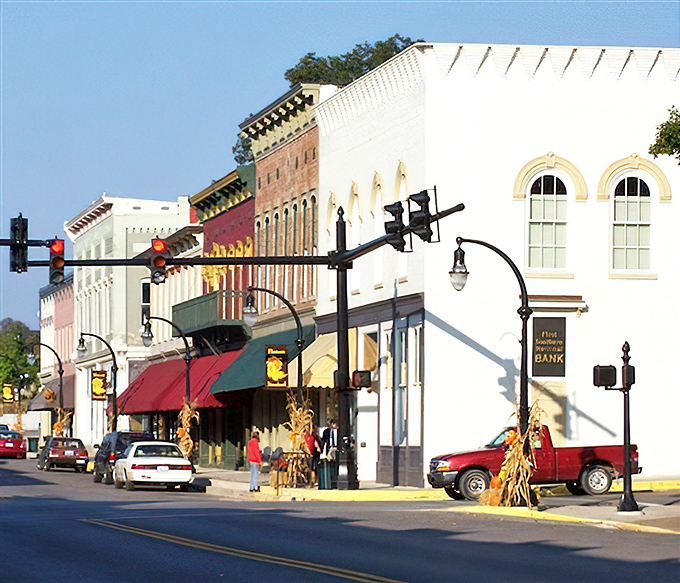 Fall decorations frame this classic Main Street view&mdash;no focus group designed this aesthetic, just generations of practical beauty evolving naturally.